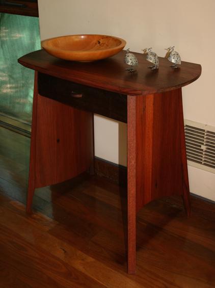 Jarrah kingsize bed and one of a pair of side tables